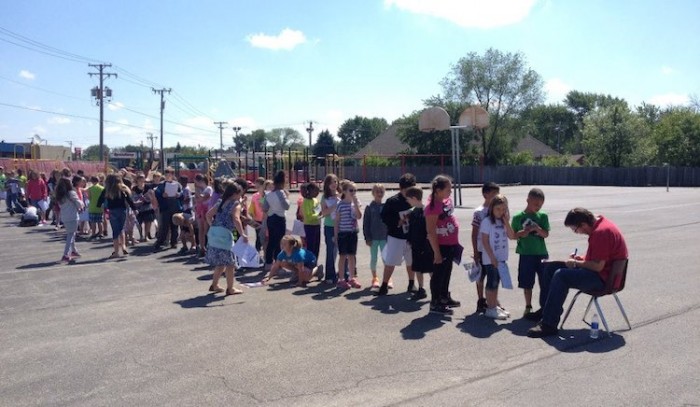 Students Wait in Line for Autographs–From School Janitor (Photo Goes Viral)