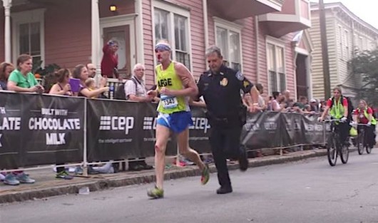 Both Winners: Police Officer Helps Injured Marathoner Get to Finish Line