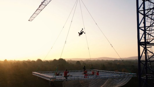 Daredevils Doing Flips on ‘World's Largest Trampoline’ Suspended From Crane Just Proves ...