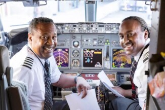 Dad Honors Career by Recreating Adorable Photo With Son Who is Now a ...