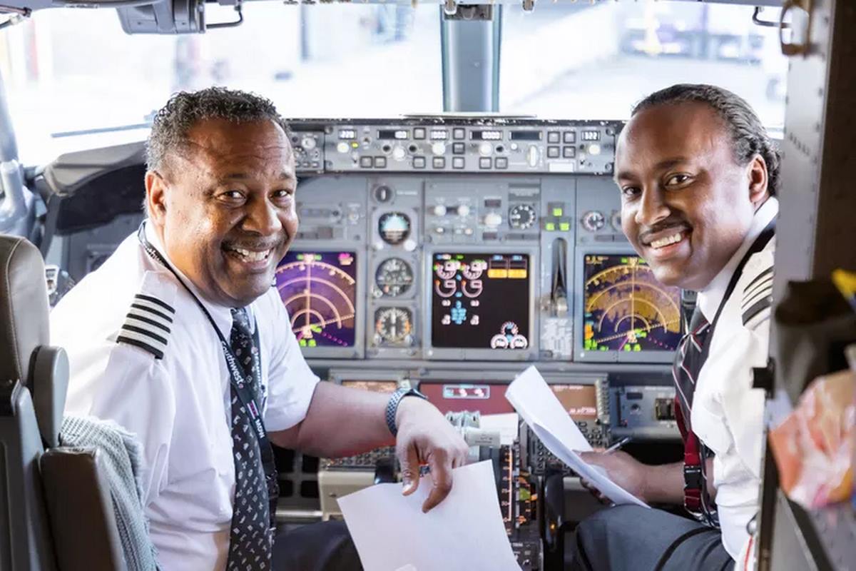 Dad Honors Career by Recreating Adorable Photo With Son Who is Now a ...