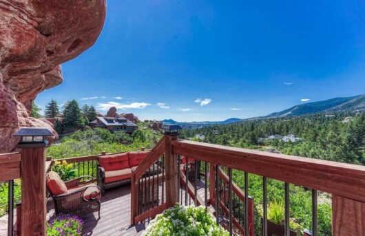 Flintstones-like Home is Built Around 200 Million-Year-old Red Rock in ...