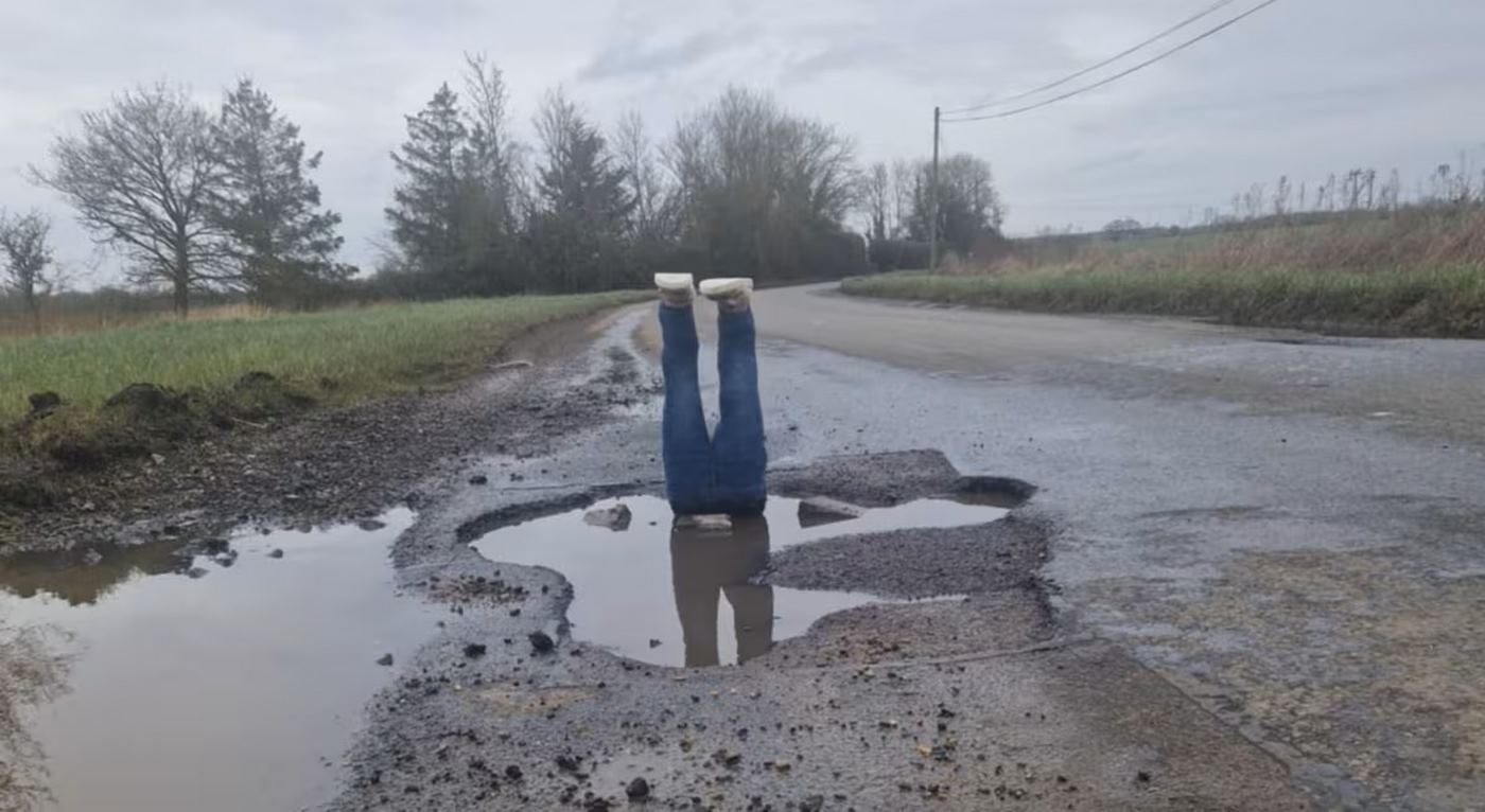 Pothole Prank: Man Erects Fake Legs in the Road and the Neglected Hole ...