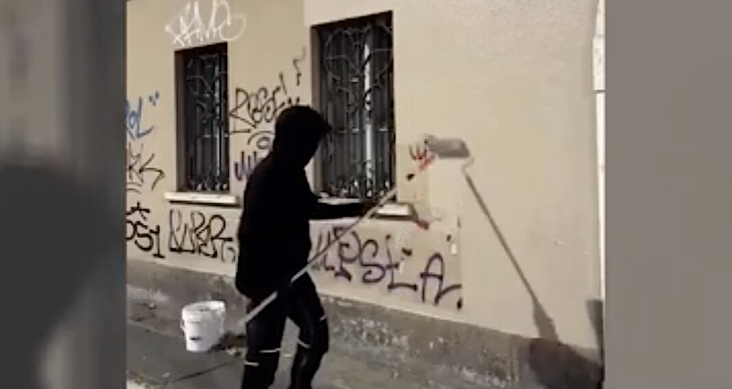 Masked Hero Goes Viral for Painting Over Graffiti on Buildings in ...